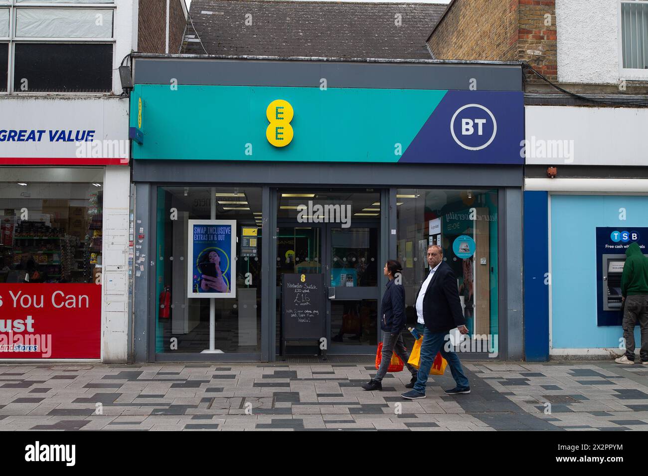 Slough, Berkshire, UK. 19th April, 2024. An EE and BT mobile phone ...