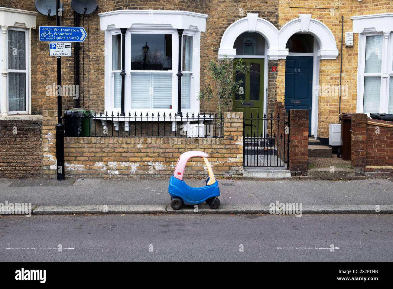 Parked car outside house on street in quiet route and cycle network ...