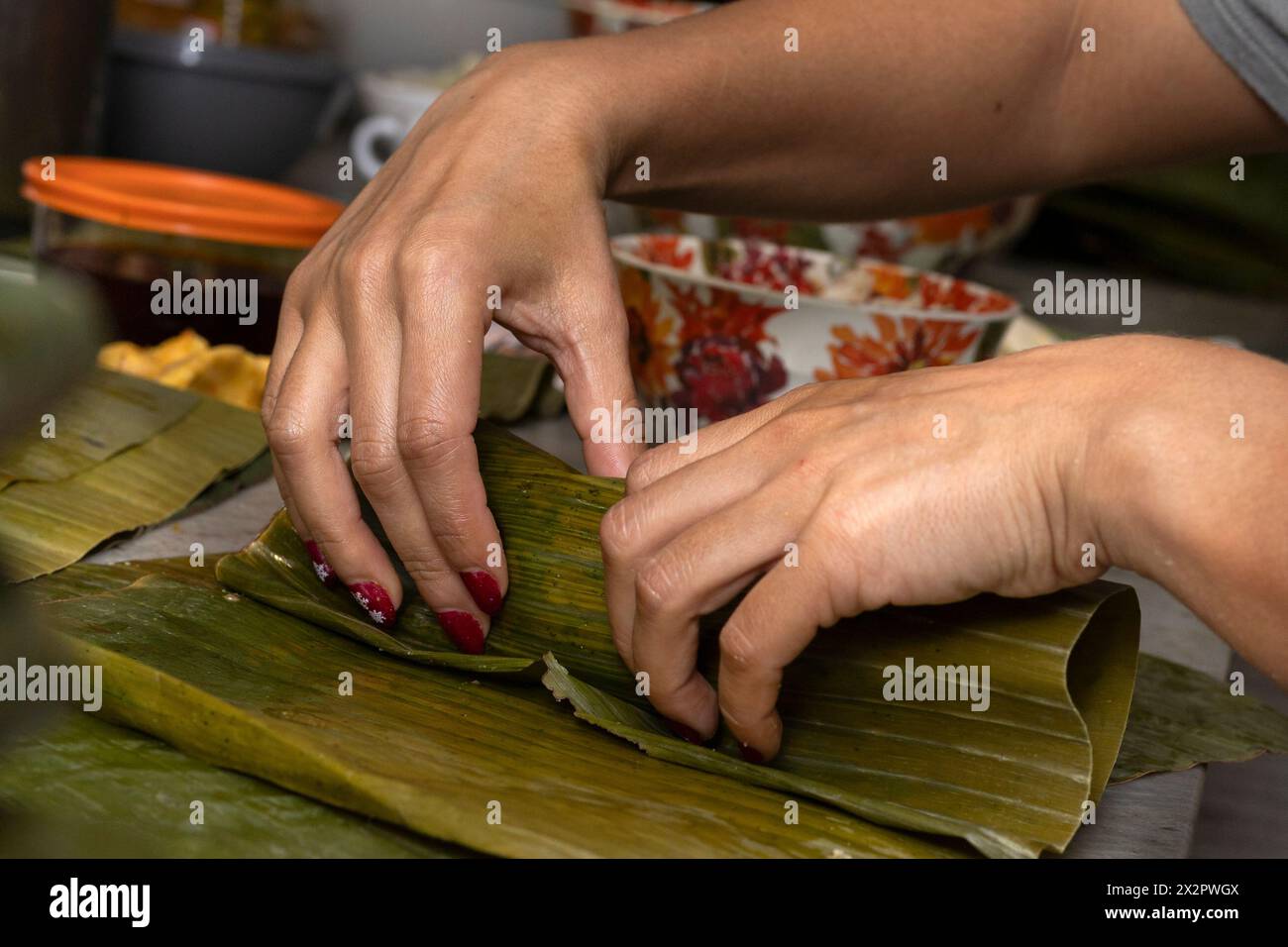 wrap a Hallaca or tamale in banana leaf Stock Photo - Alamy