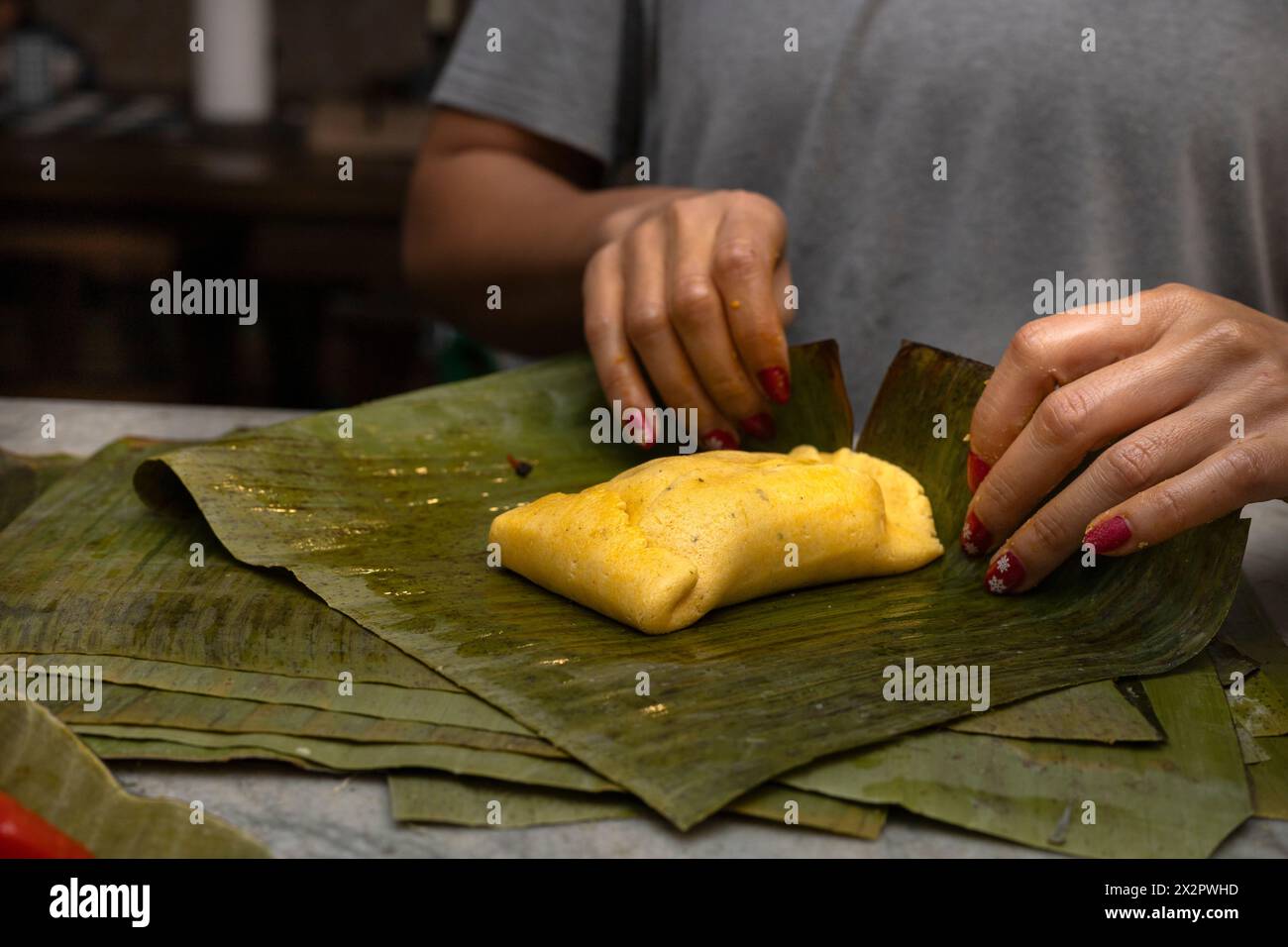 wrap a Hallaca or tamale in banana leaf Stock Photo - Alamy