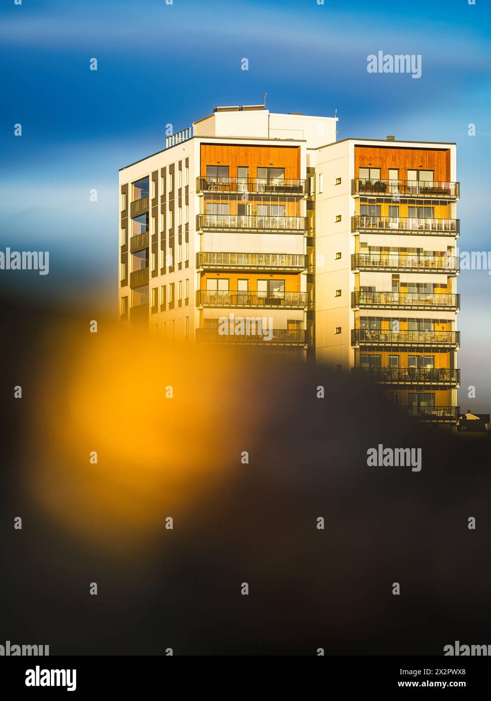 A blurry foreground of a residential building in Mölndal, Sweden ...