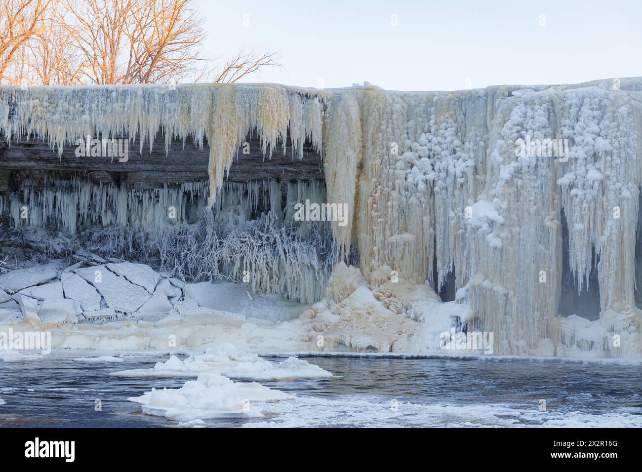 Partially frozen waterfall Jagala juga, Estonia. Water falling from ...
