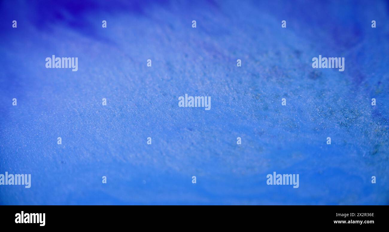 Glitter paint flow. Shimmer sand texture. Defocused purple blue color ...