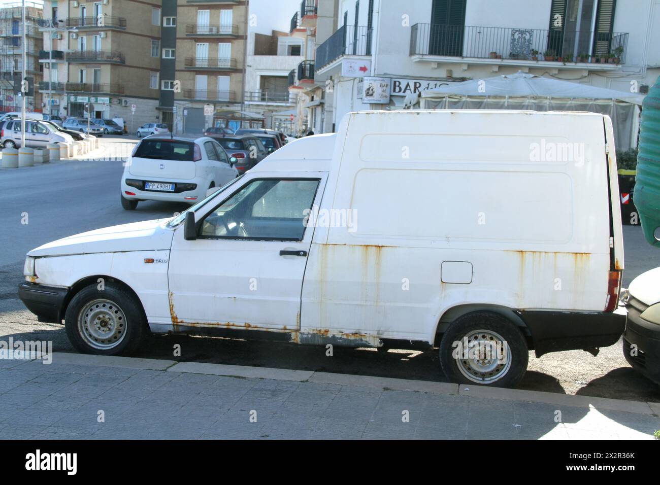 Rusty vehicle on a street in Italy Stock Photo - Alamy