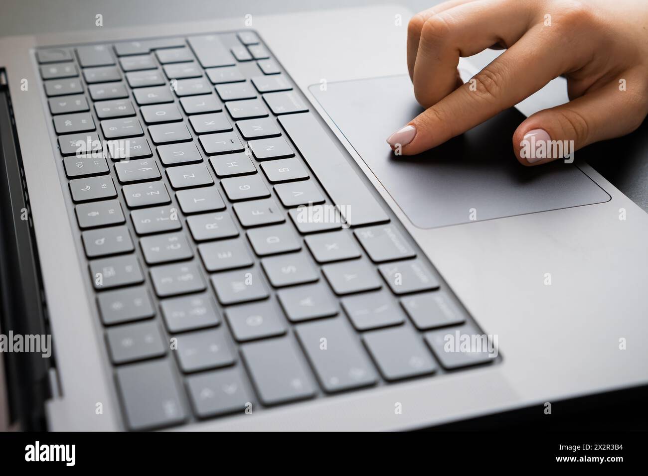 BERLIN, GERMANY - APRIL 14 2024: Female hand working on a computer ...