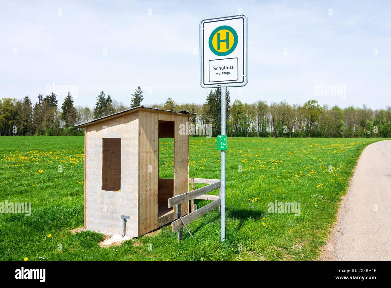 Valley: bus stop for school bus with verry small wooden shelter in ...