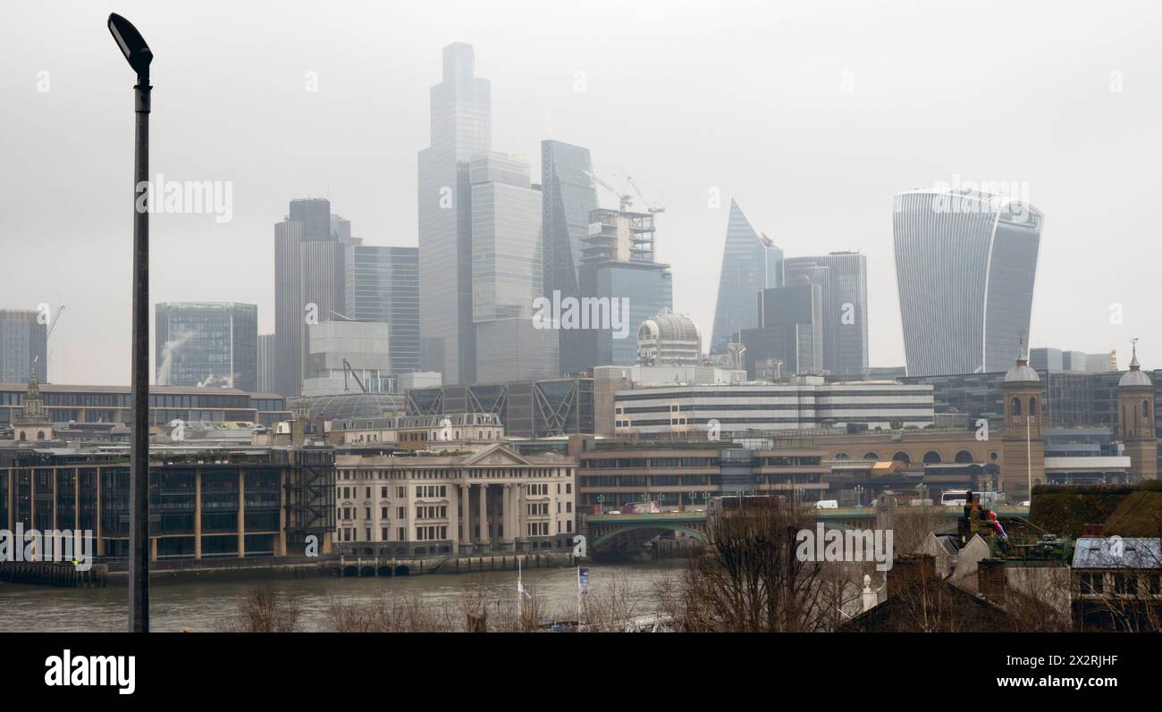 Hazy London skyline seen from River Thames in winter Stock Photo - Alamy