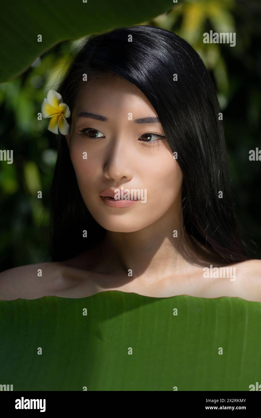 Woman flower leaves hi-res stock photography and images - Alamy