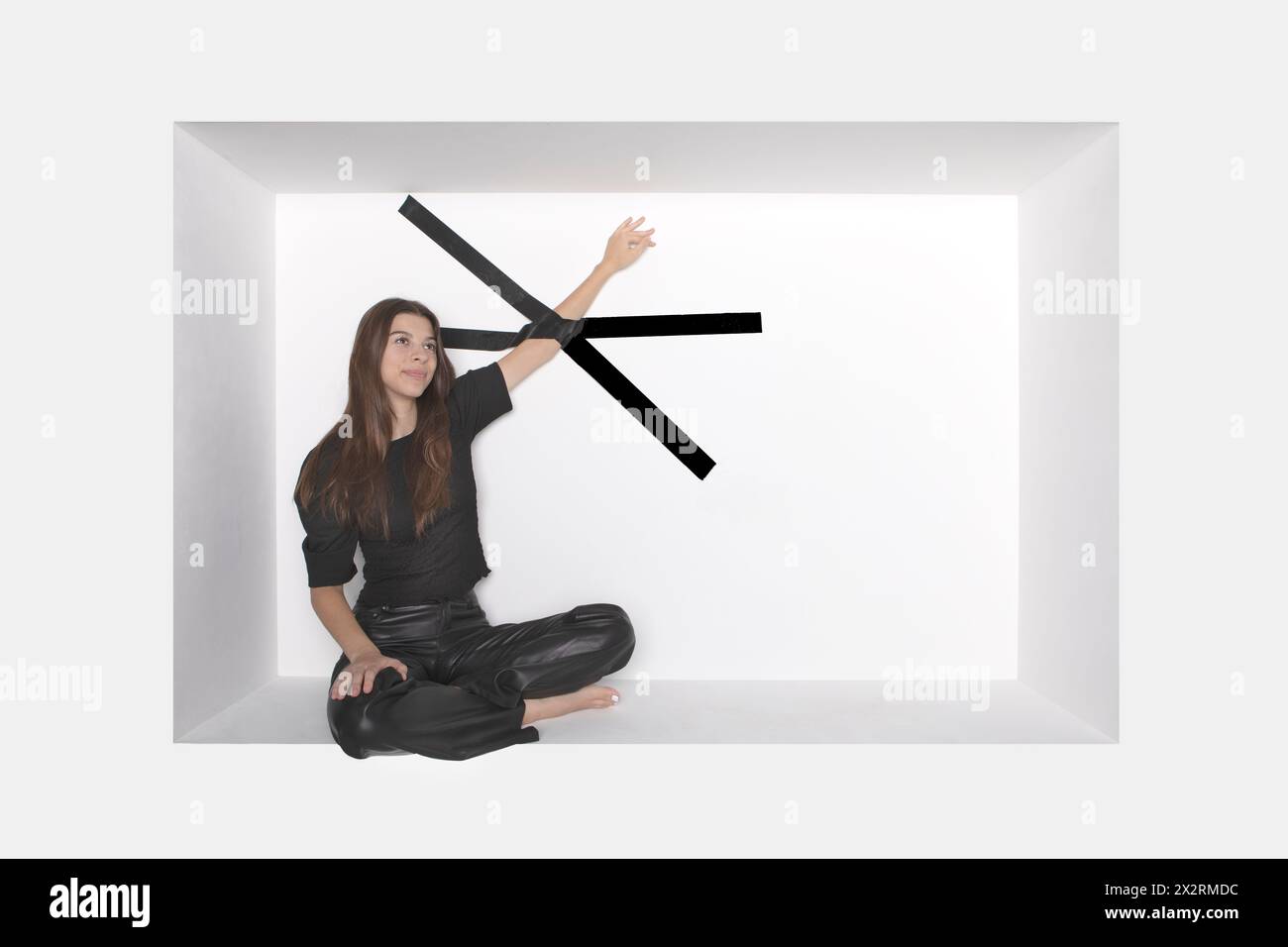 Thoughtful girl with black adhesive tape stuck on hand Stock Photo - Alamy