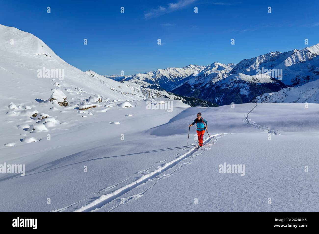 Mature woman back country skiing on Junsjoch, Tux Alps, Tyrol, Austria ...
