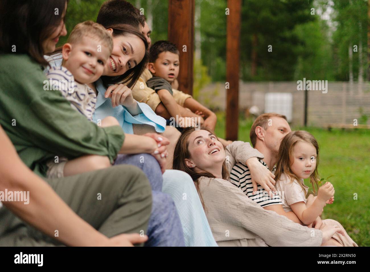 Happy family and friends gathering on summer vacation Stock Photo - Alamy