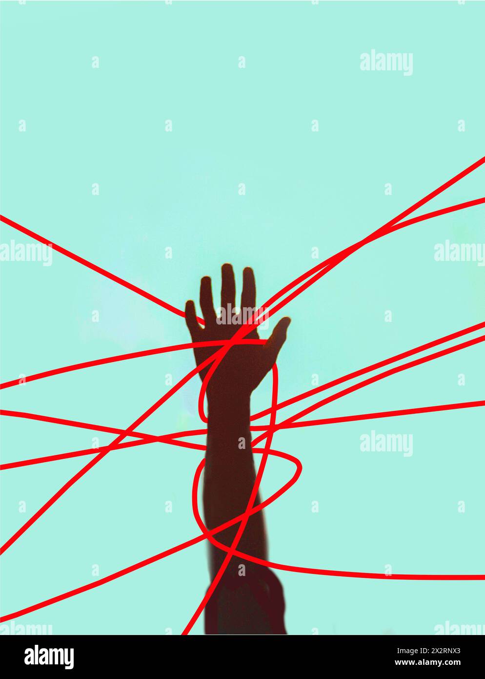 Hand of unrecognizable person tangled in red strings against colored ...