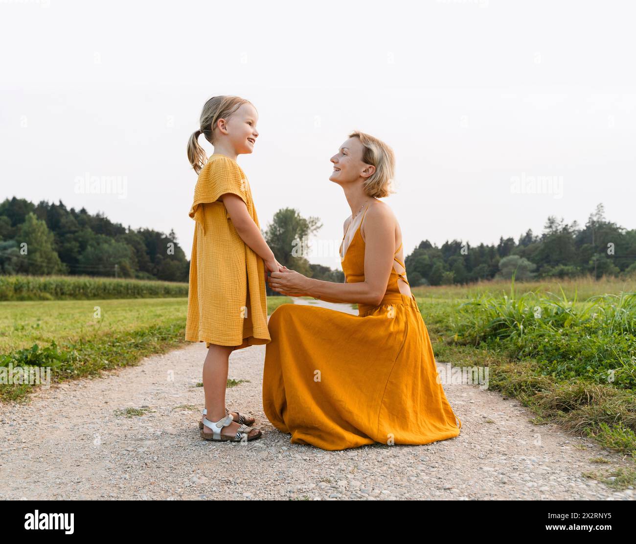 Childhood holding crouching bonding hi-res stock photography and images ...