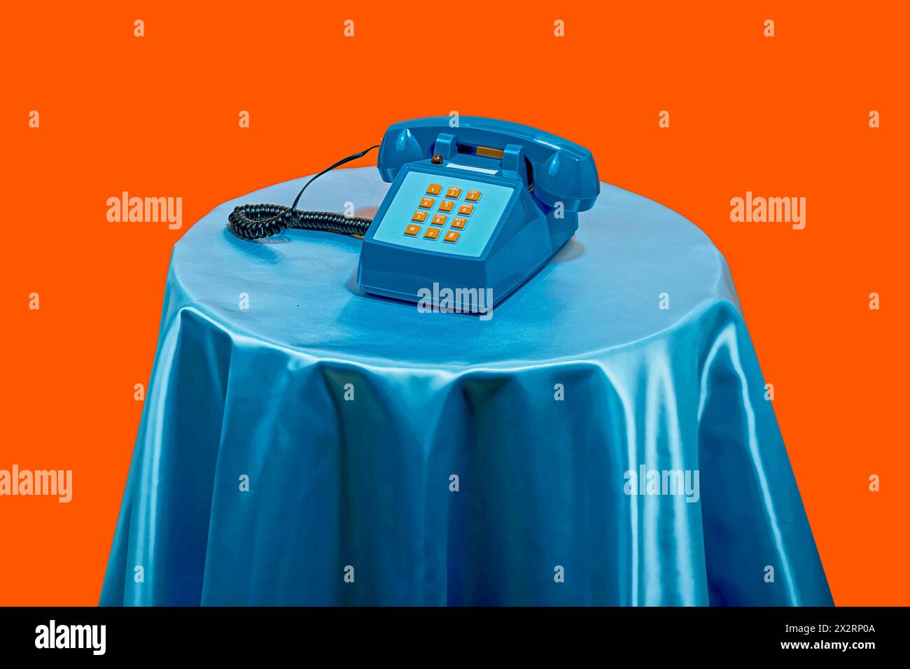 Vintage style telephone on table against orange background Stock Photo ...