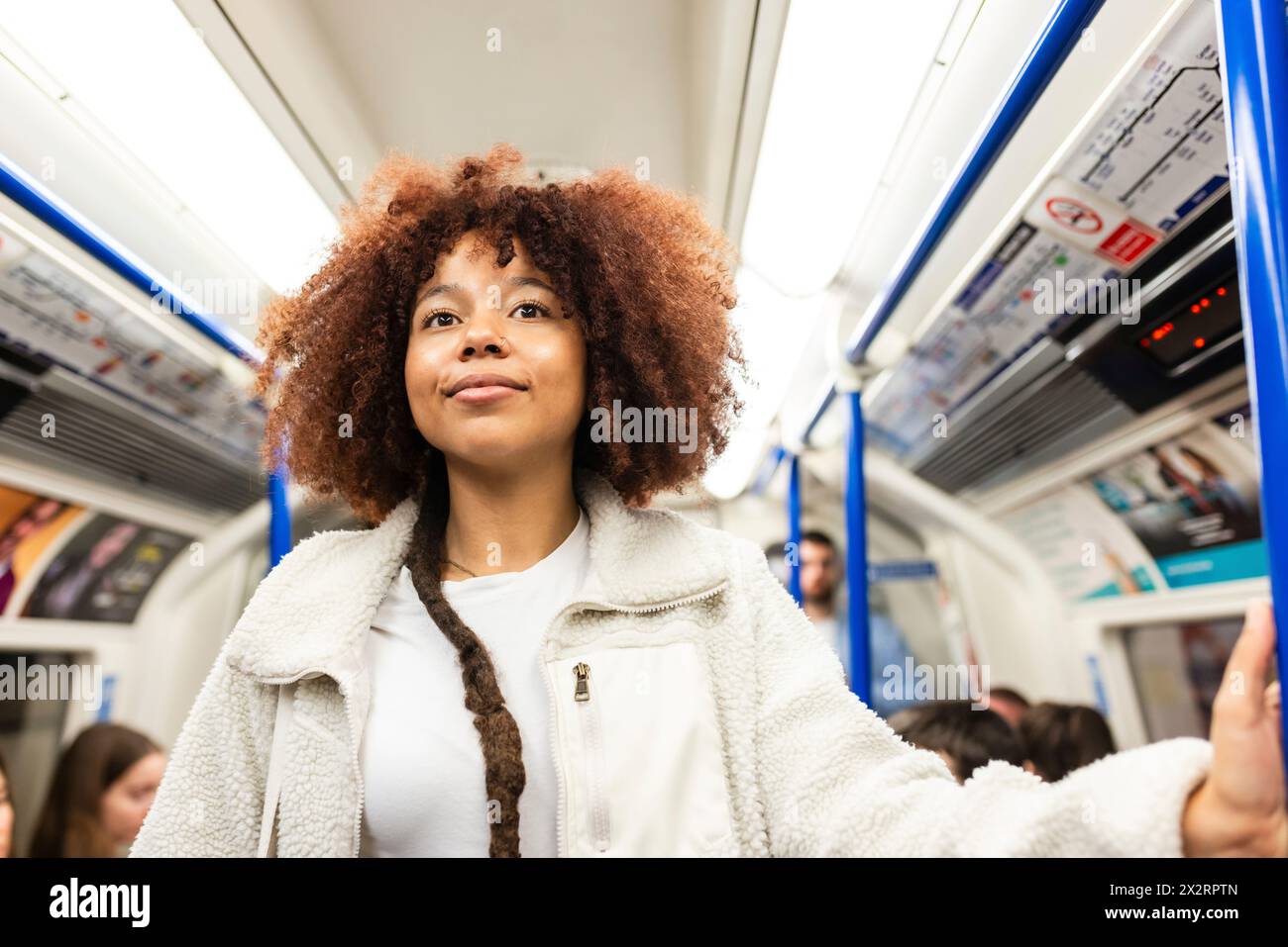Female passenger in train subway hi-res stock photography and images ...