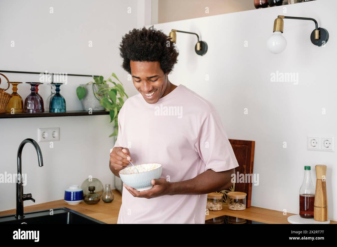 Man eating breakfast in kitchen hi-res stock photography and images - Alamy
