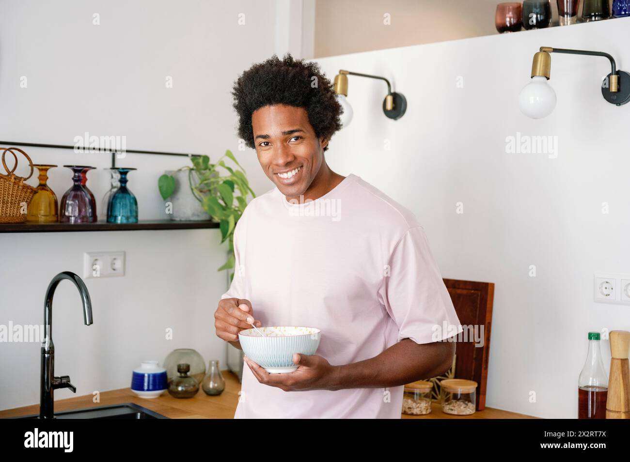 Man eating breakfast in kitchen hi-res stock photography and images - Alamy