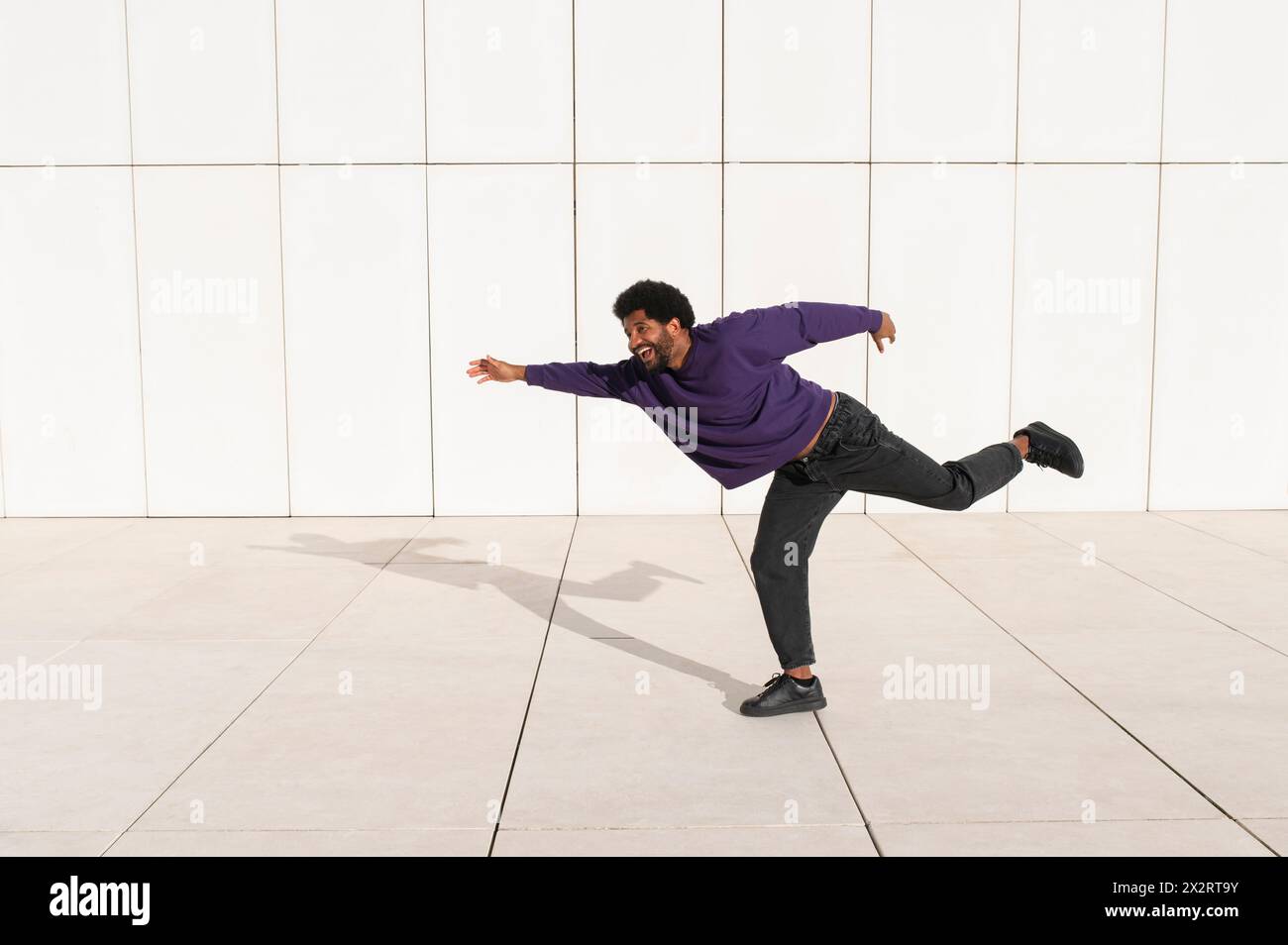 Man standing on one leg hi-res stock photography and images - Alamy