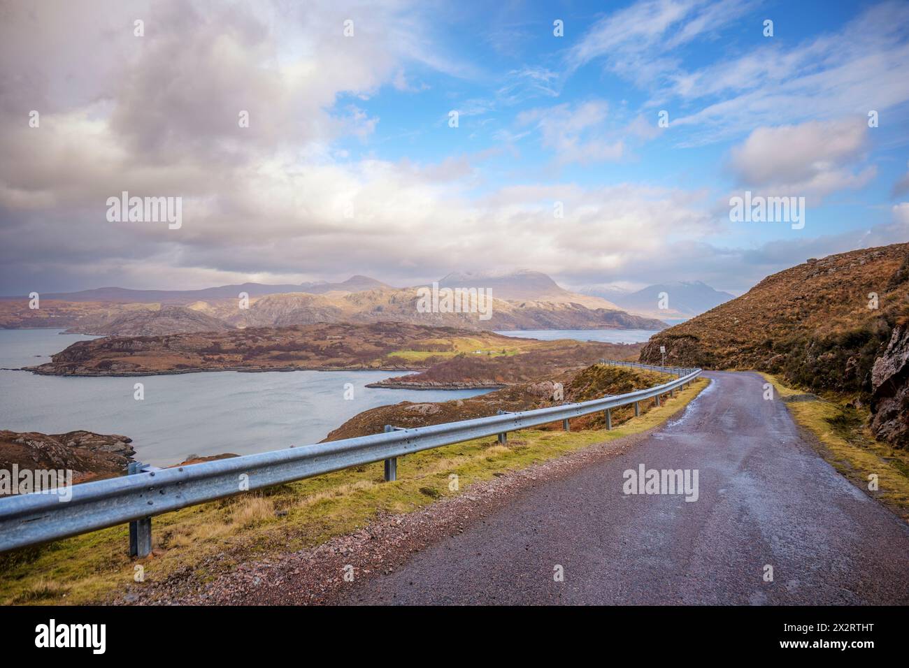 UK, Scotland, Strathcarron, Clouds over Loch Torridon with asphalt road ...