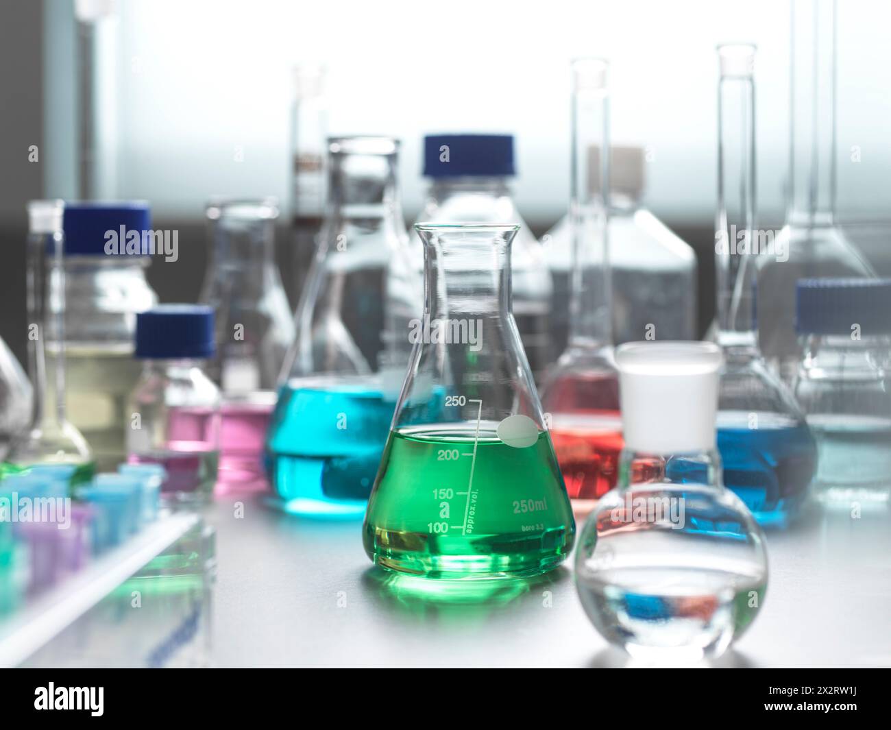 Laboratory glassware with multi colored chemical sample Stock Photo - Alamy