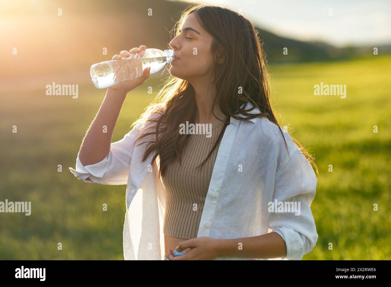 Woman drink water on white hi-res stock photography and images - Alamy