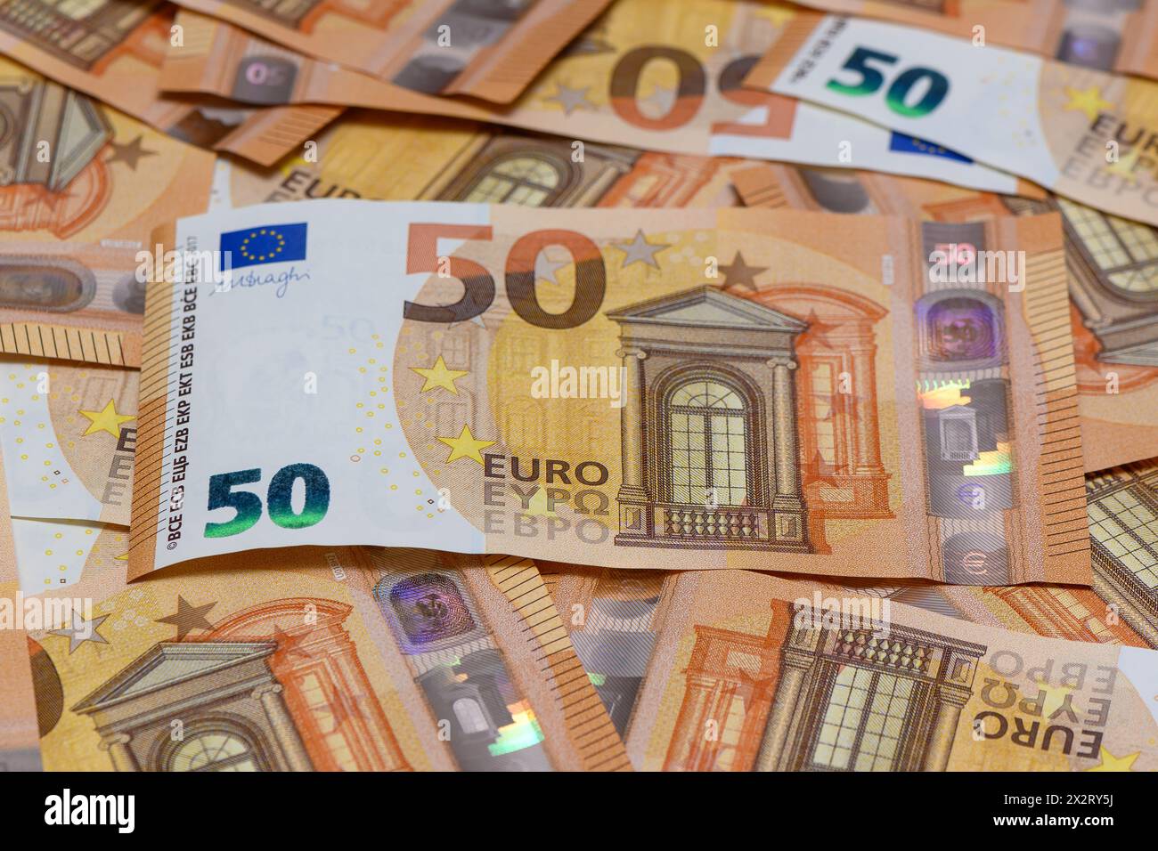 Pile of 50 euro notes business background Stock Photo - Alamy