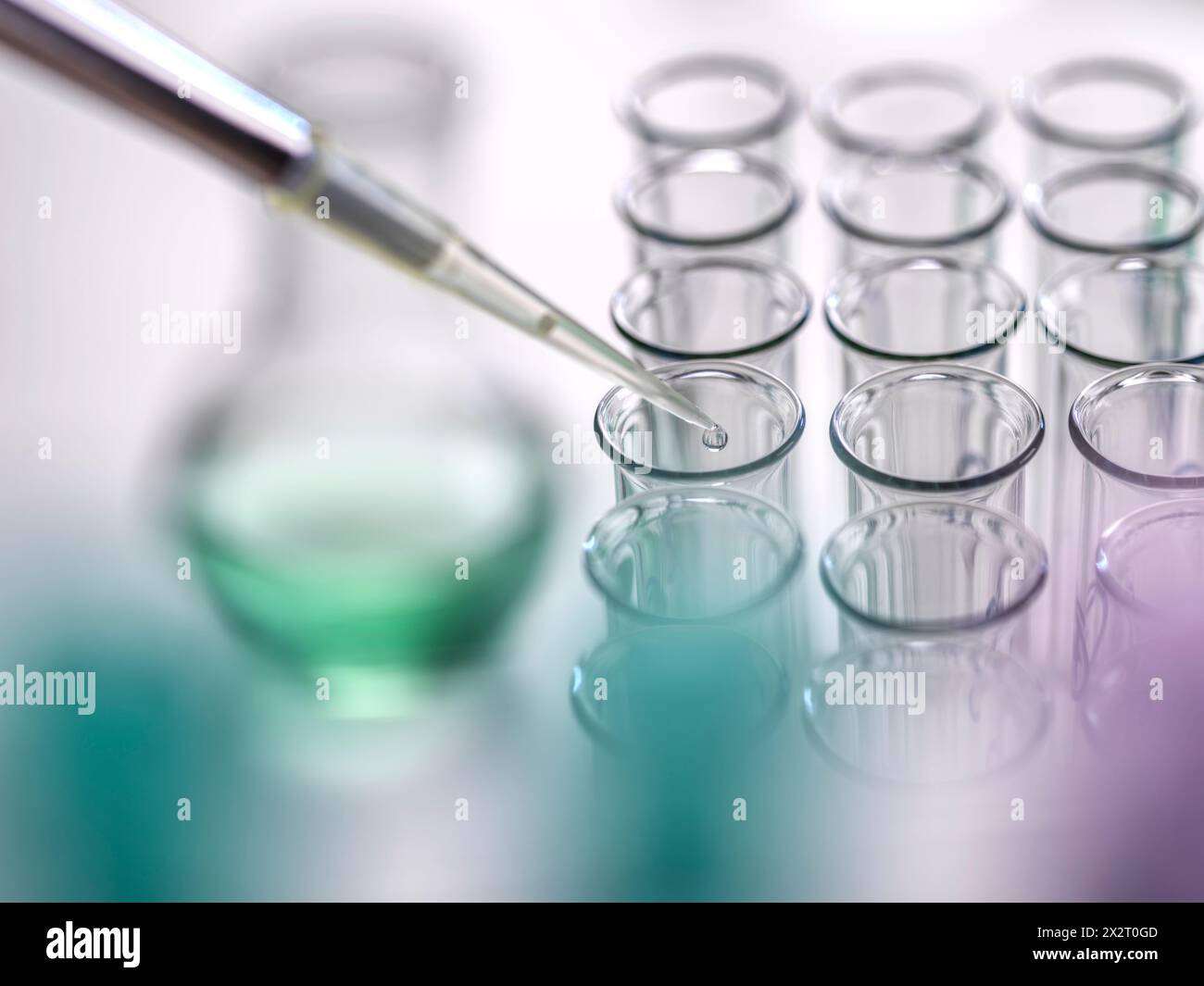 Pipette dropping sample of medicine in test tubes at lab Stock Photo ...