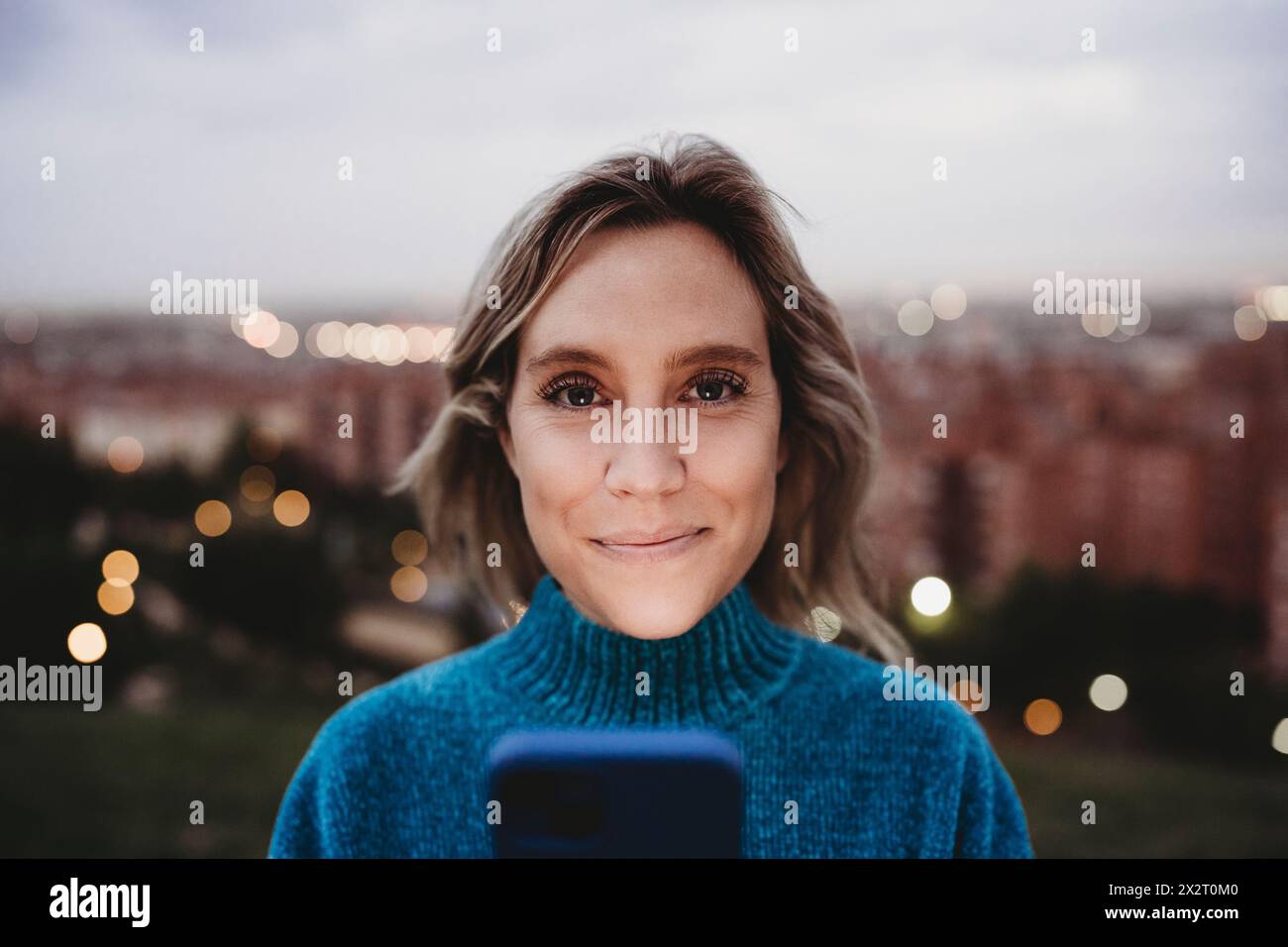 Person wearing blue sweater hi-res stock photography and images - Alamy