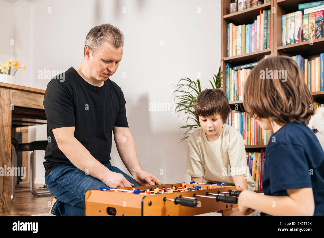 Father playing foosball children hi-res stock photography and images ...
