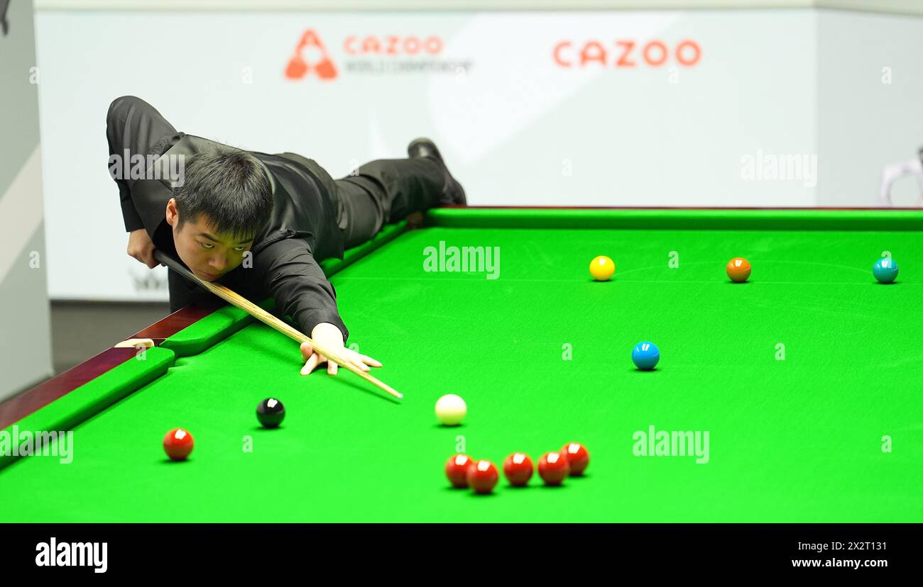 Pang Junxu plays a shot during his match against Robert Milkins on day ...