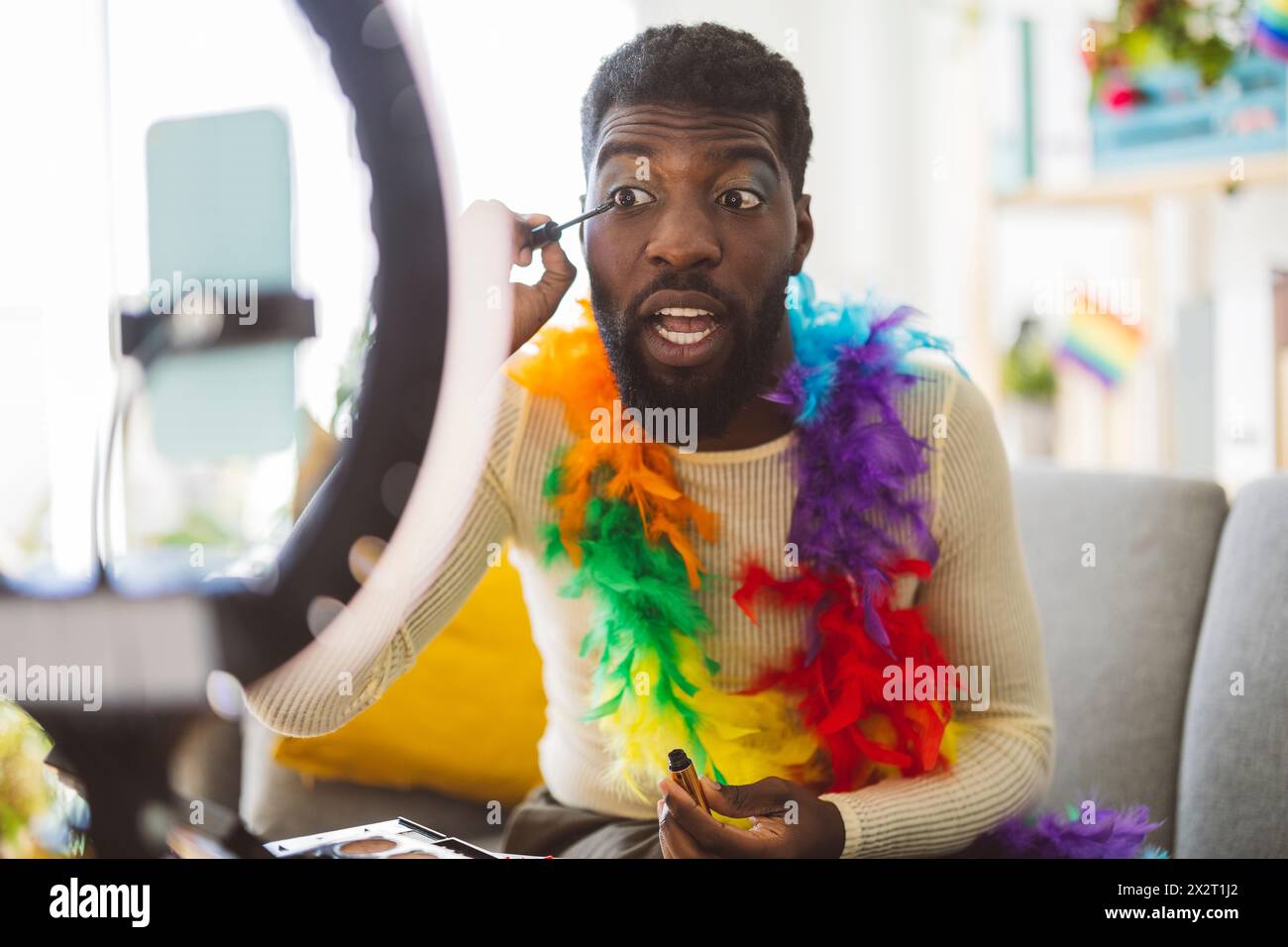 Young non-binary person getting ready and making vlog at home Stock ...