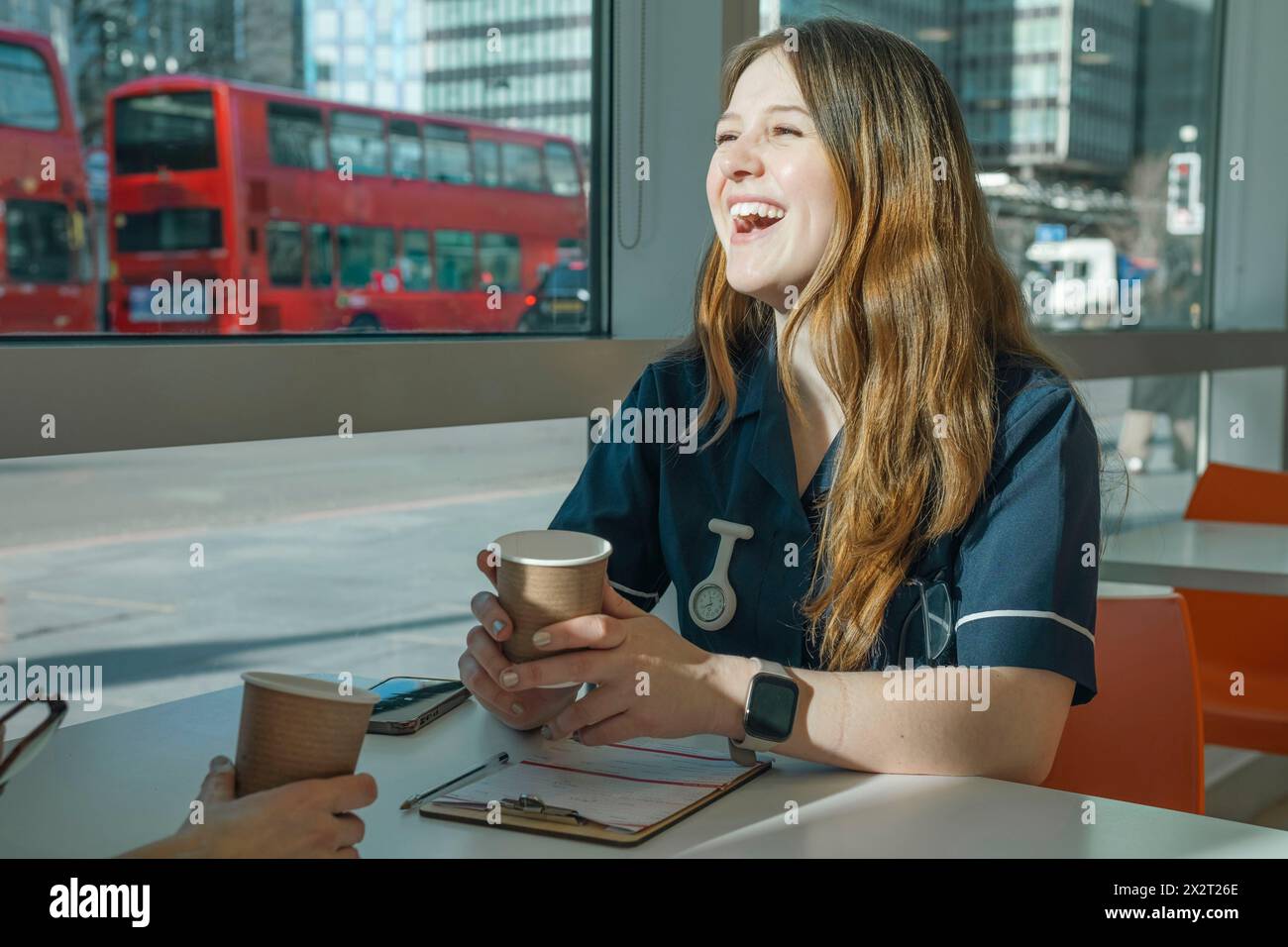 Doctor holding clipboard colleagues hi-res stock photography and images ...
