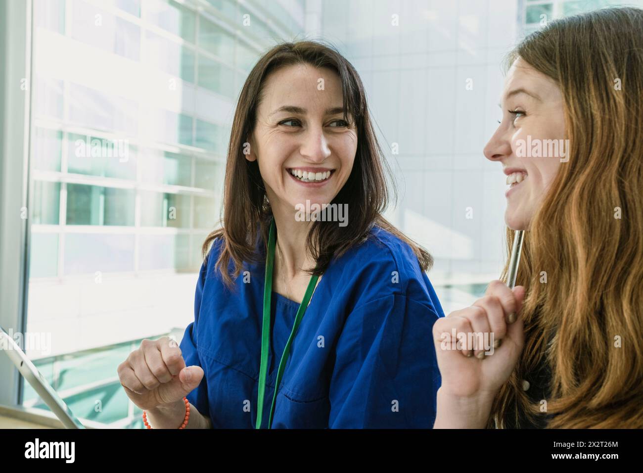 Happy nurse in scrubs holding hi-res stock photography and images - Alamy