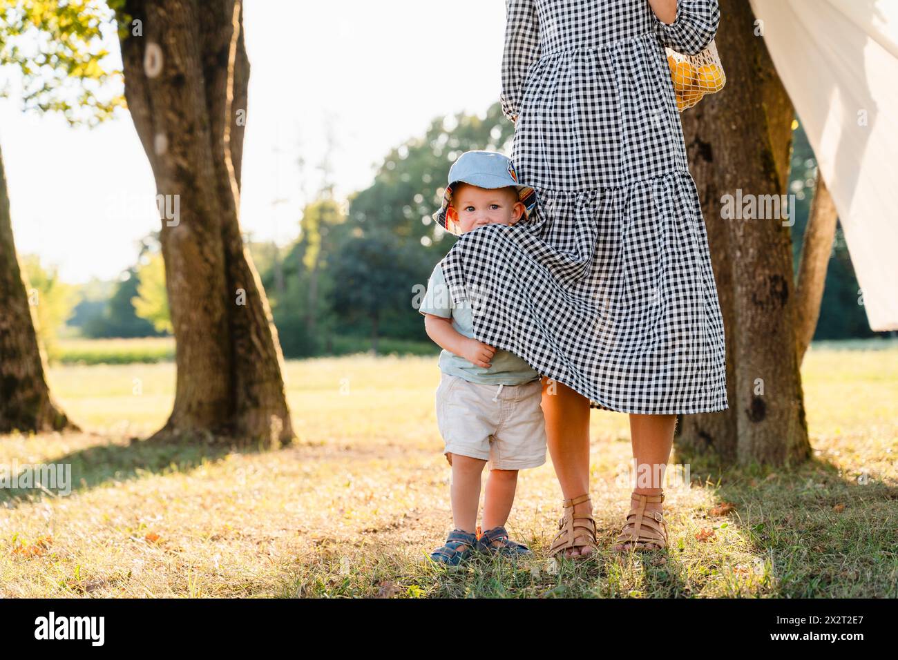 Toddler hiding mother hi-res stock photography and images - Alamy