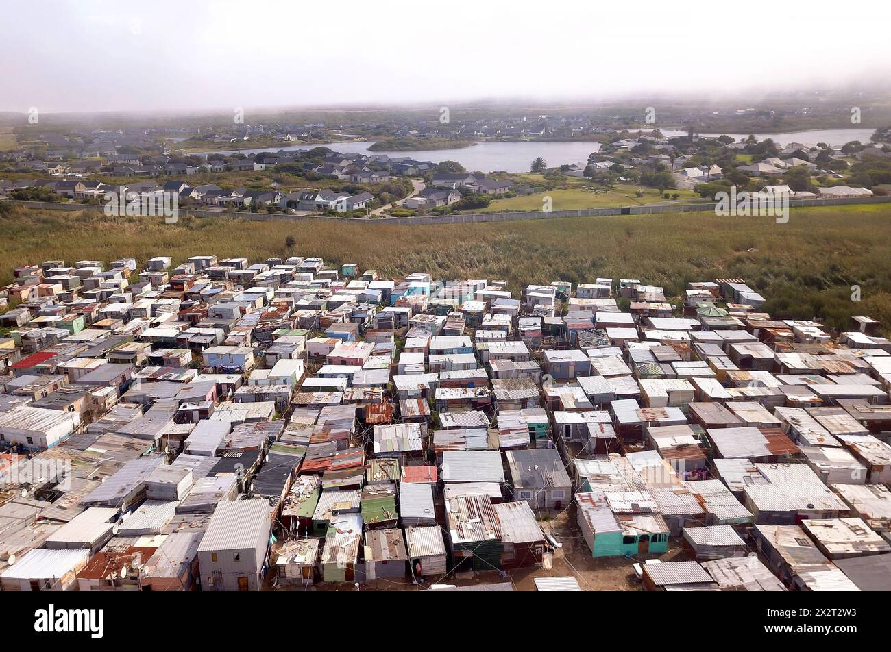 Aerial of township and wealthy houses in divided South Africa Stock ...