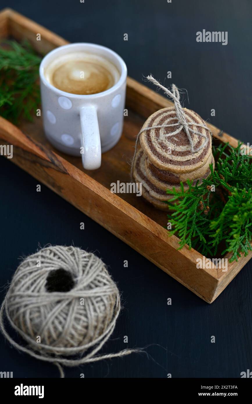 Cookies, fir tree twigs and mug of coffee on wooden tray Stock Photo ...