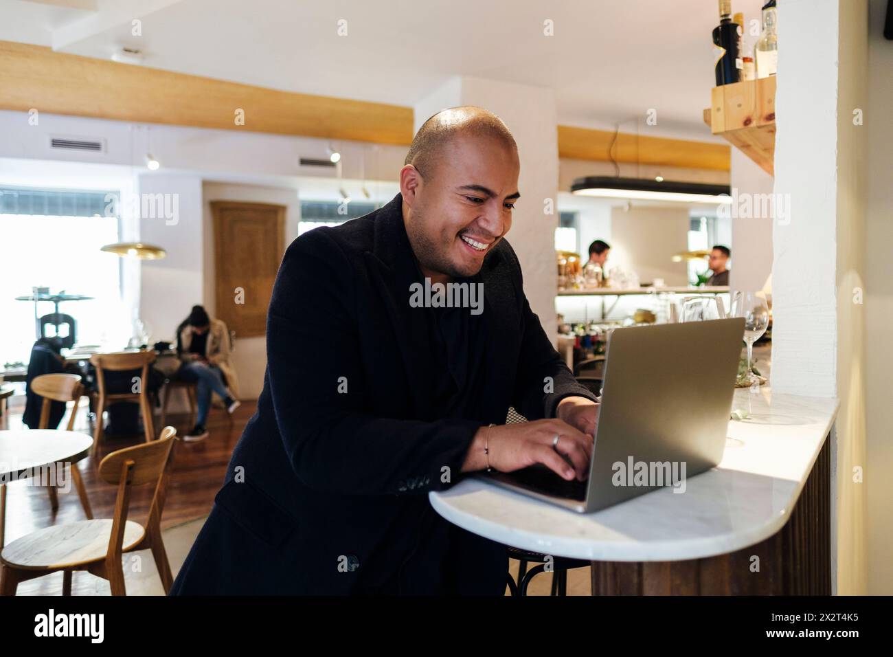 Male customer using laptop hi-res stock photography and images - Alamy