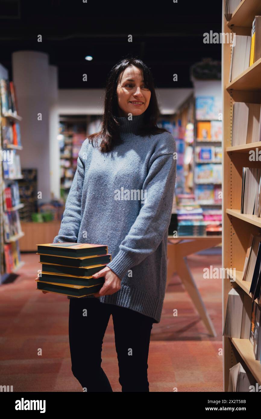 Person standing on stack books hi-res stock photography and images - Alamy