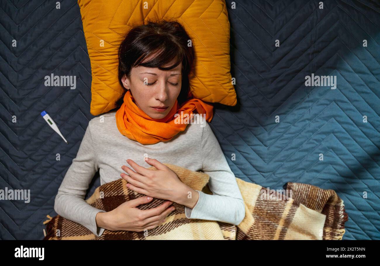 Sick woman sleeping on bed at home Stock Photo - Alamy
