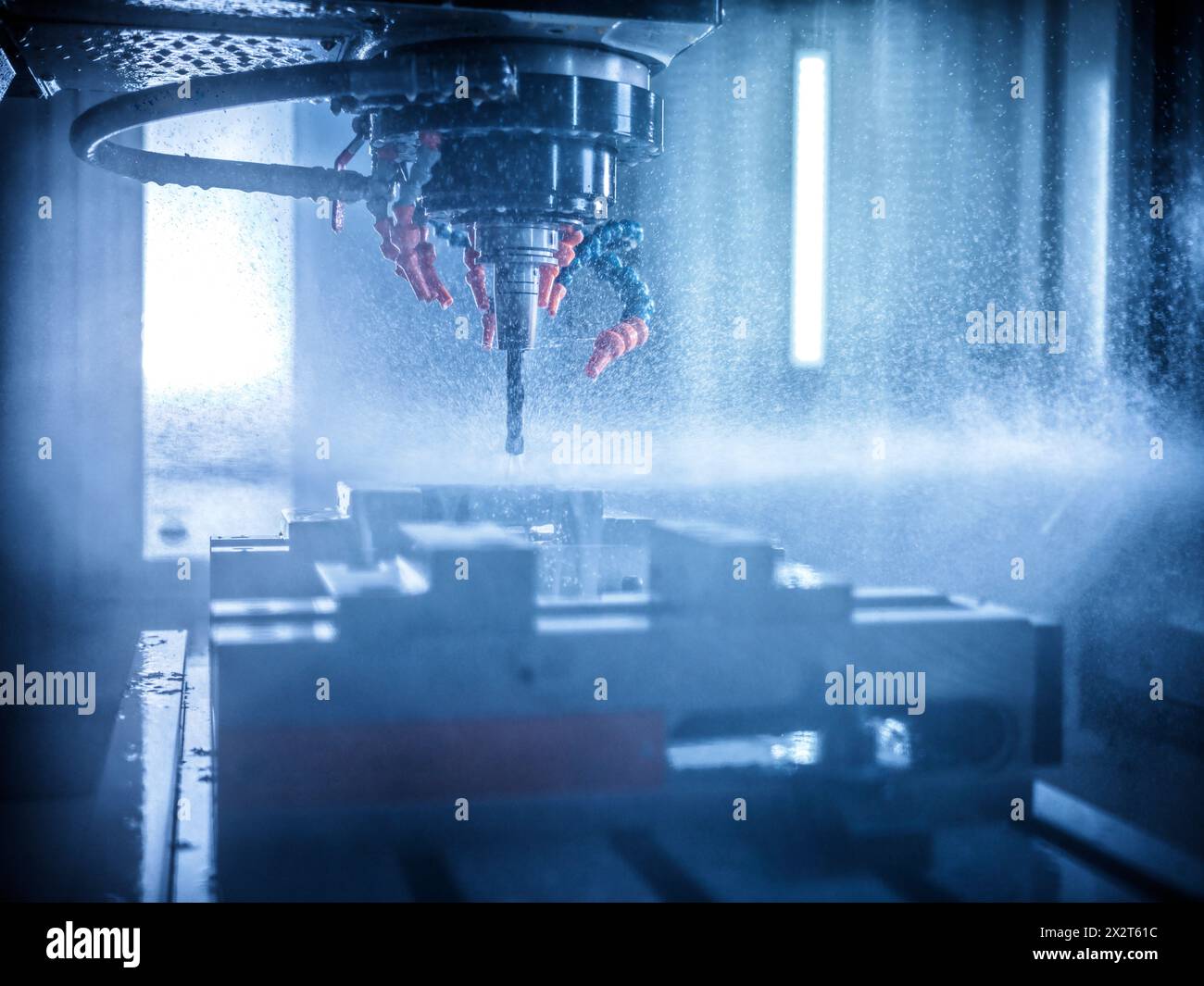 High speed drill amidst water spray at factory Stock Photo - Alamy