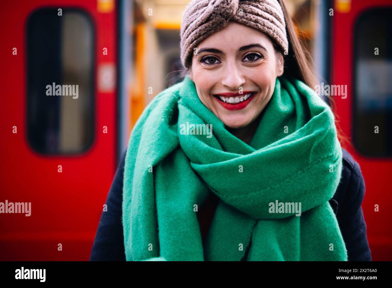Woman scarf train transportation smile hi-res stock photography and ...