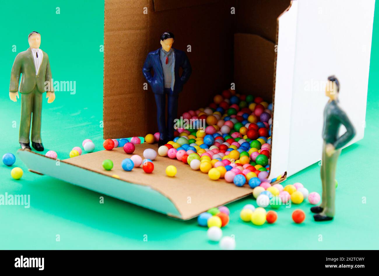 Executives reviewing contents of packaging box Stock Photo - Alamy