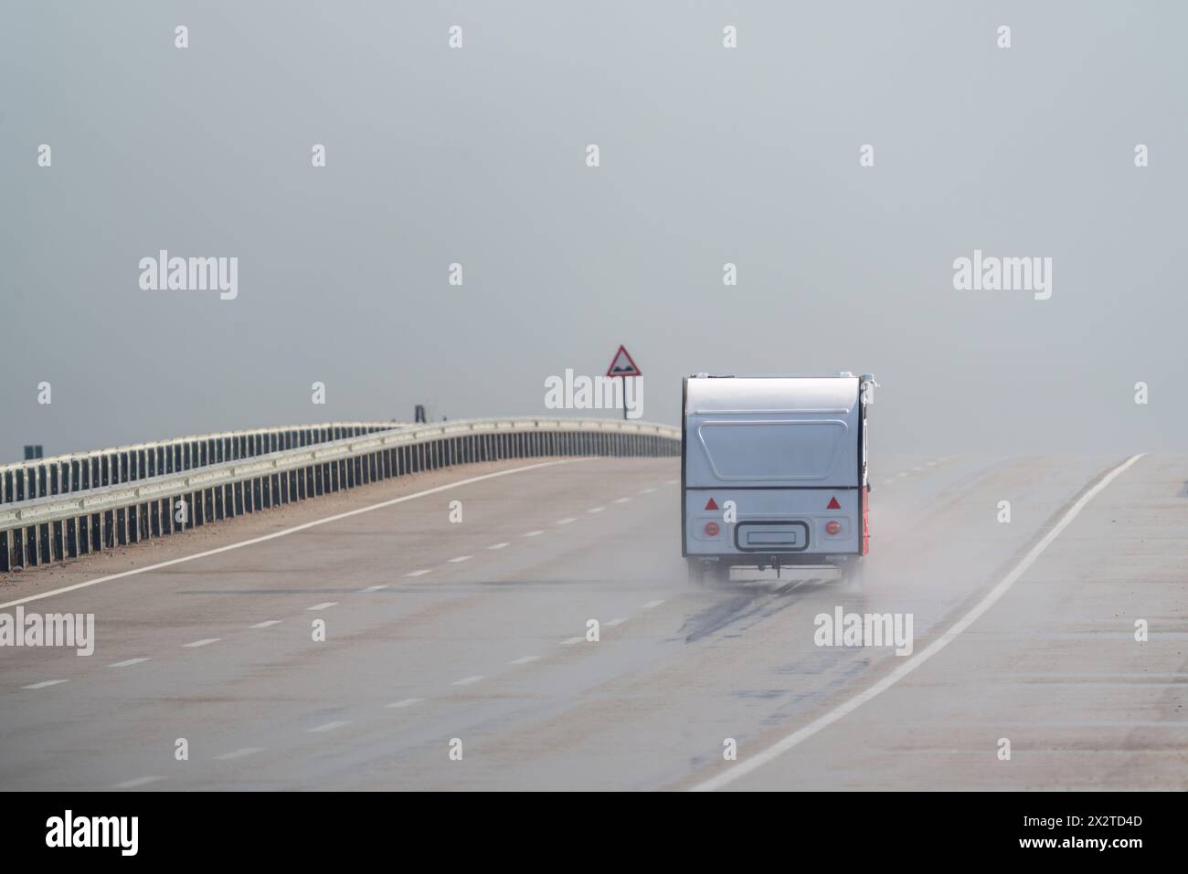 Caravan driving on the motorway in the rain. Motorway in the rain Stock ...