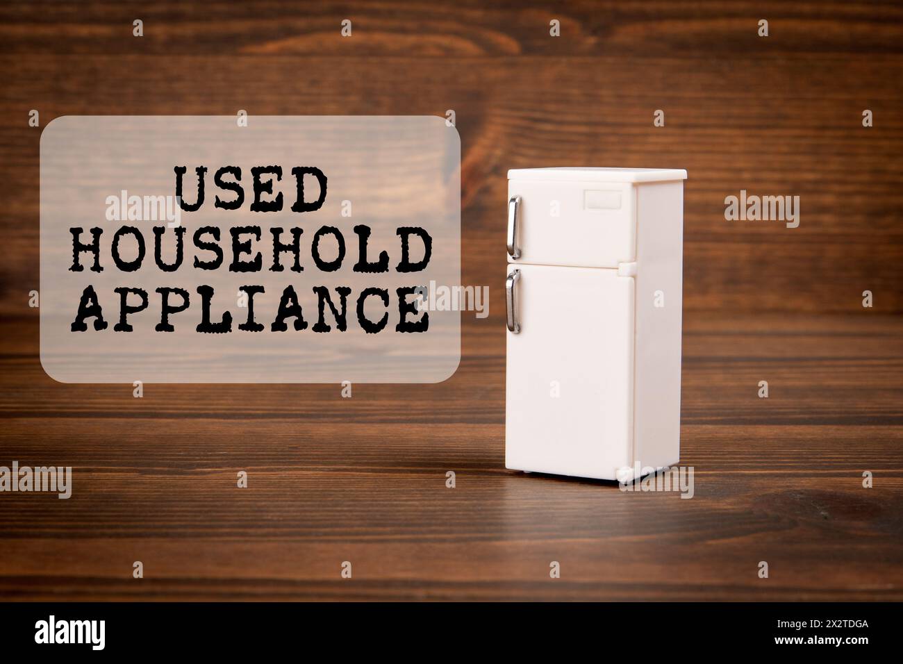 Used Household Appliance. Old miniature refrigerator on wood texture ...