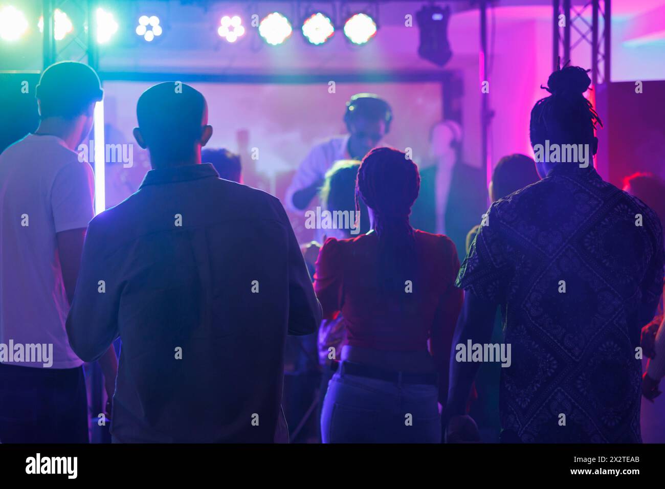 People partying and attending dj performance at nightclub discotheque ...