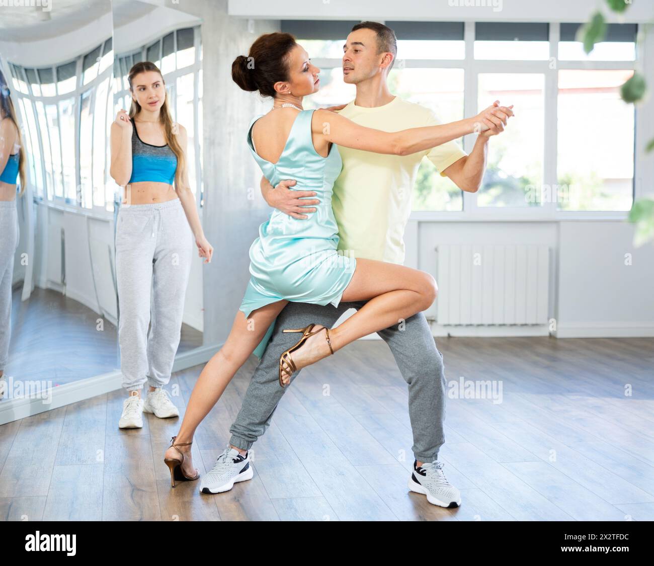 Coach, paired with man student, shows master class and explains ...