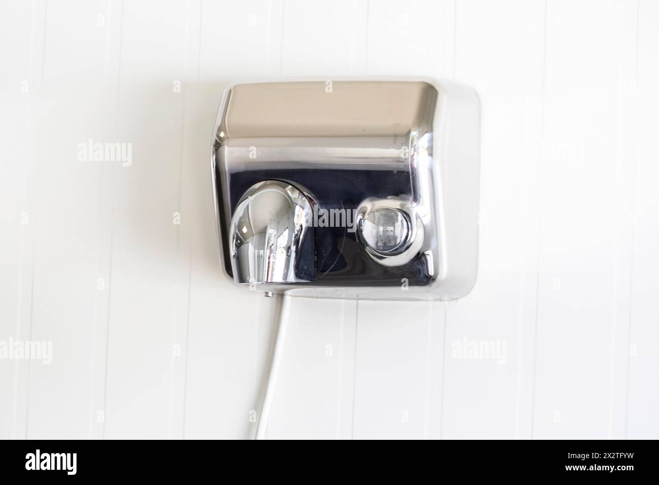 hand dryer in the toilet room. Modern Design Trends Stock Photo - Alamy