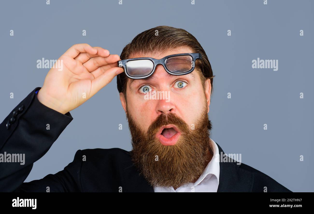 Closeup portrait of excited astonished shocked man takes off glasses ...