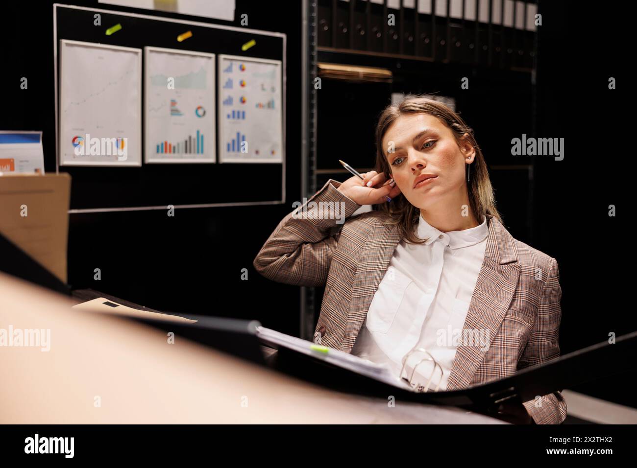 Private detective analyzing crime scene report, searching for new clues ...