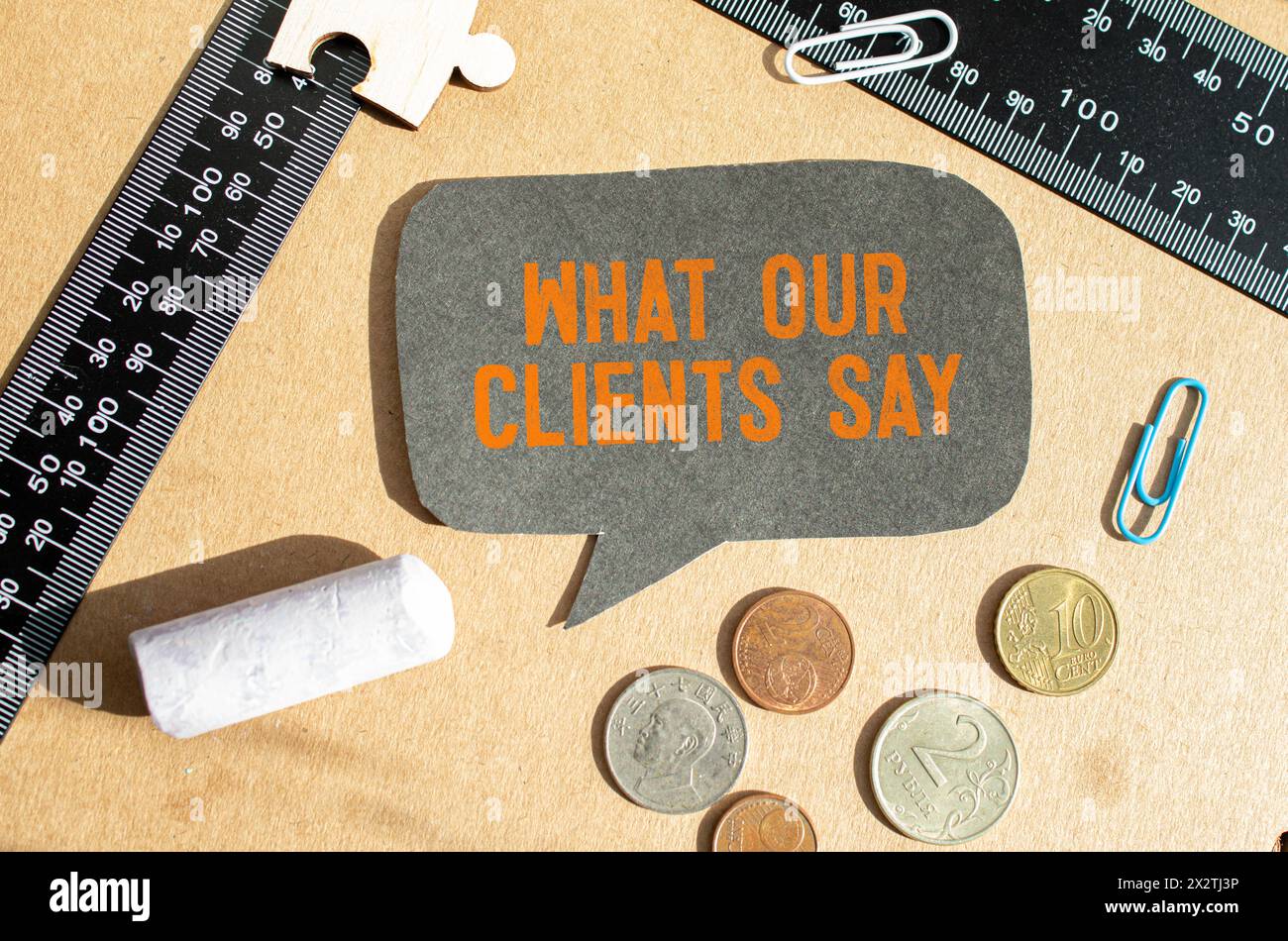 What Our Clients Say statement on paper note pad. Office desk with ...
